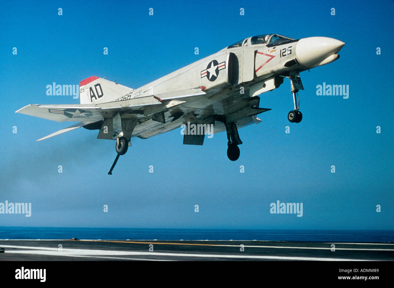 F-4 Phantom jet fighter landing on an aircraft carrier Stock Photo ...