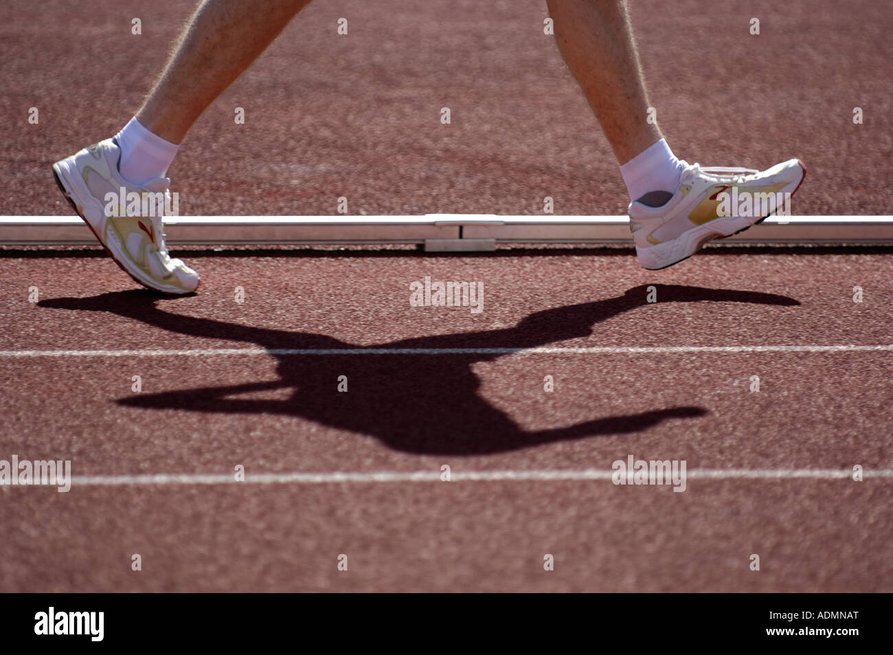 Shadow of race walker Stock Photo - Alamy