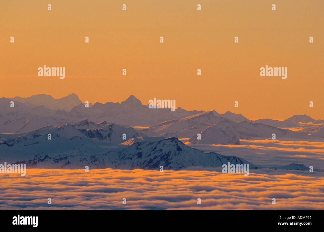 German-Austrian alps with fog covering the valley, at sunrise ...