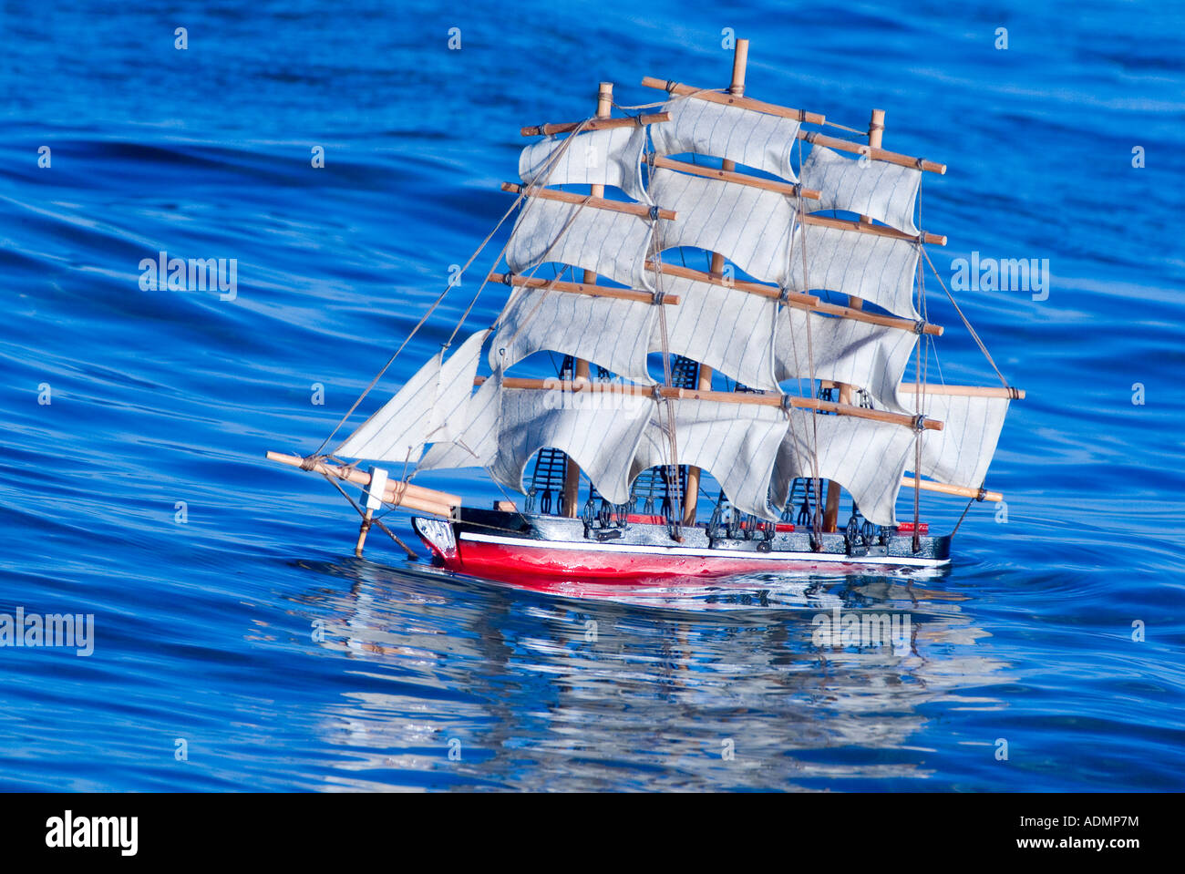 Three masted sailing ship floating on ocean Stock Photo - Alamy