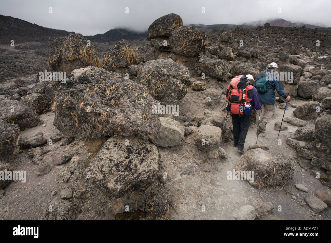 Two hikers climbing through rocks hi-res stock photography and images ...