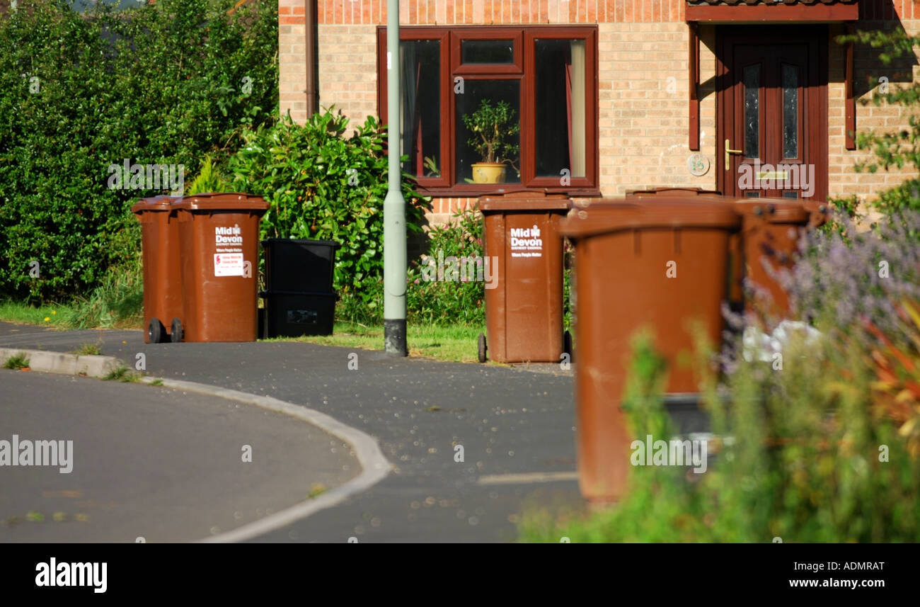 A line of wheely bins awaiting collection in Tiverton Devon Stock Photo ...