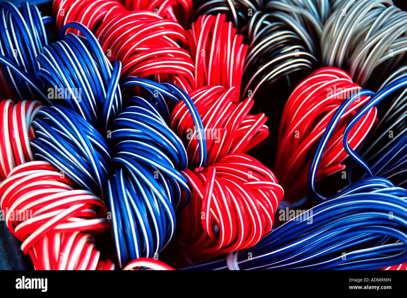 Red blue and grey wire cords Stock Photo - Alamy