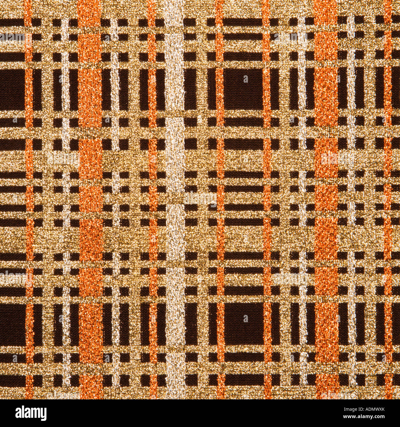 Close up of woven vintage fabric with brown and gold crossbar pattern ...