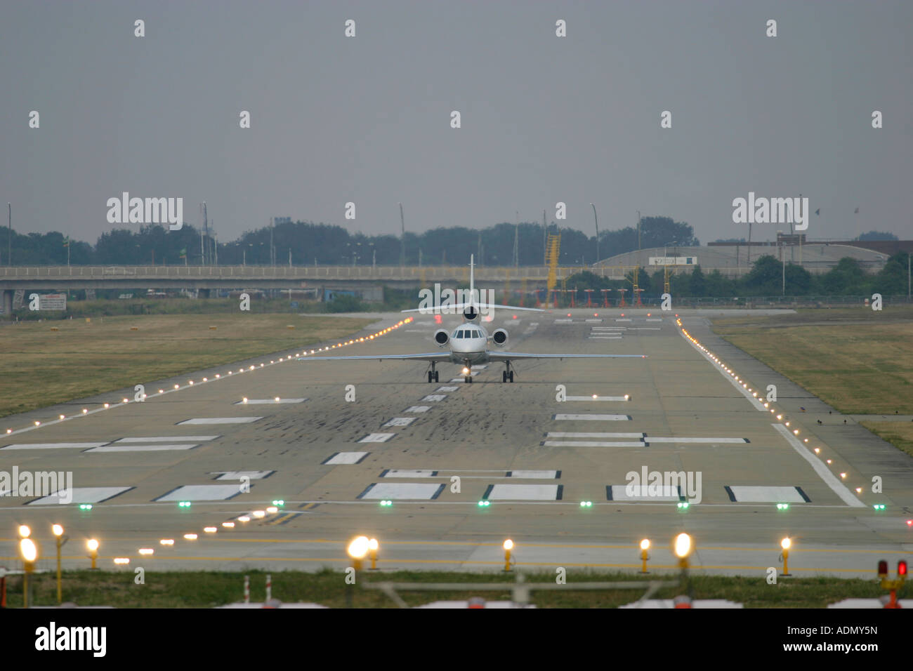 Corporate jet on runway Stock Photo - Alamy