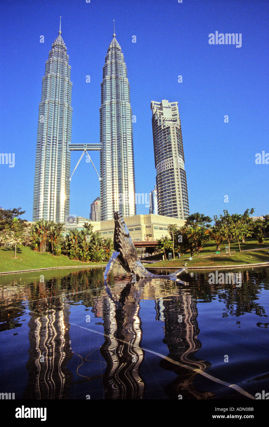 dolphin structure at KLCC park with Petronas Twin Towers and Maxis ...