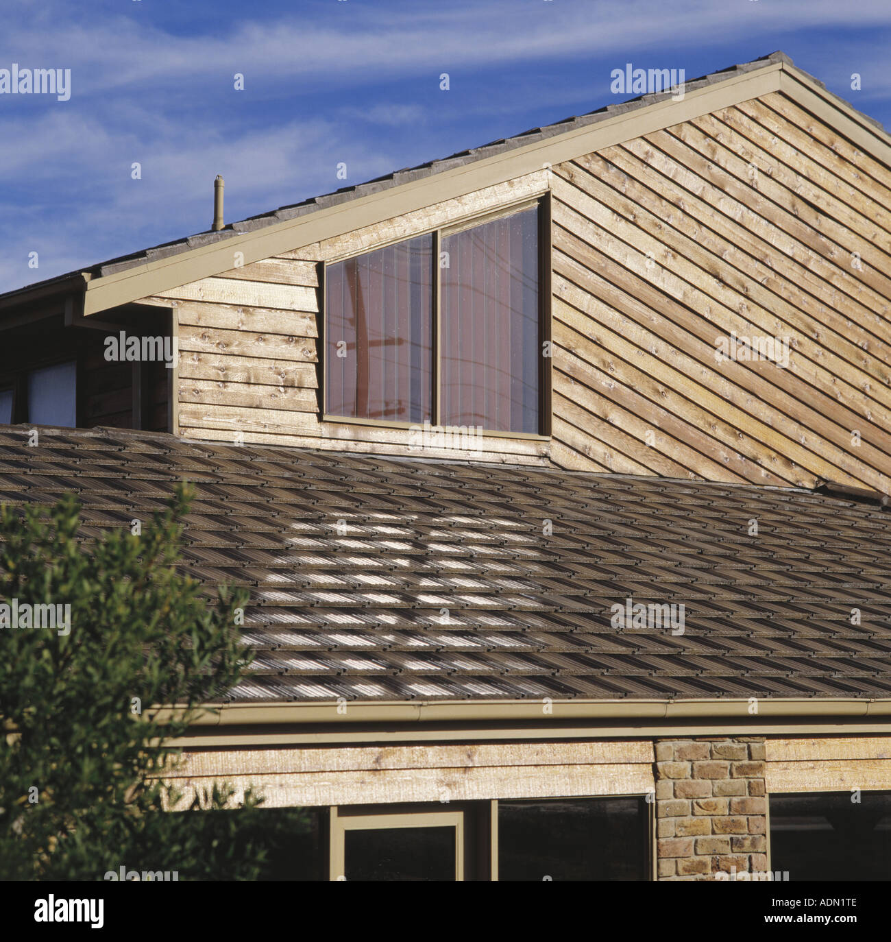 Modern House Exterior with Wood Panelling Stock Photo - Alamy