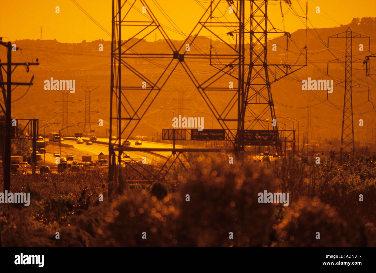 power poles Powerlines stretch over southern california in the sunset ...