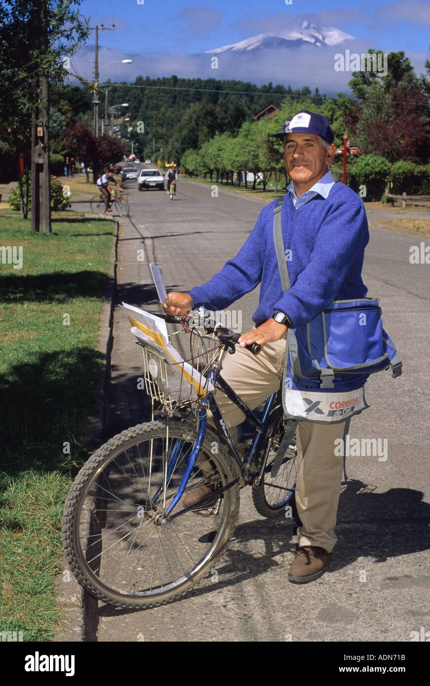 A postman on his bike in rural Chile Stock Photo - Alamy