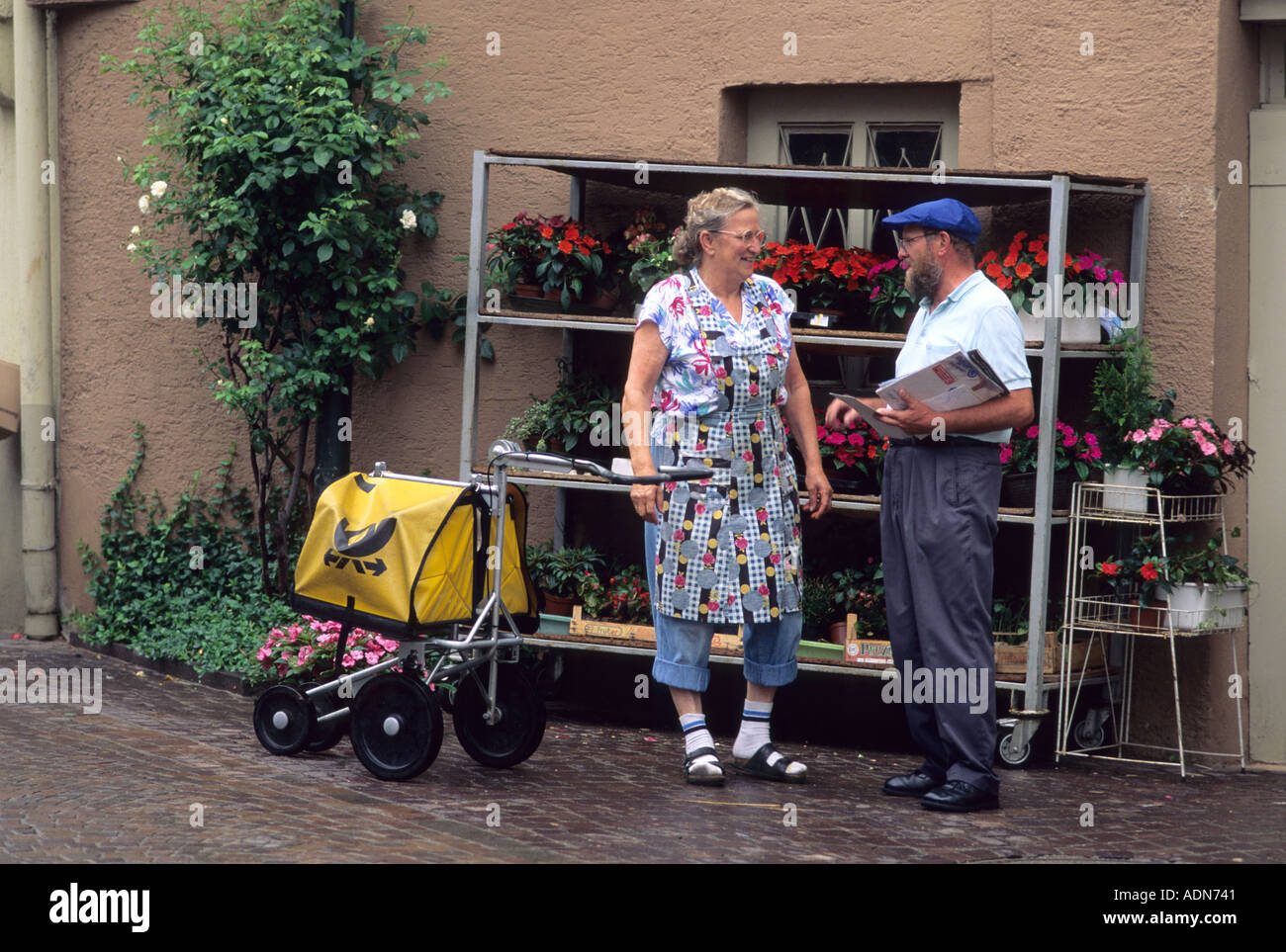 A postman bringing the mail to a resident in Germany Stock Photo - Alamy