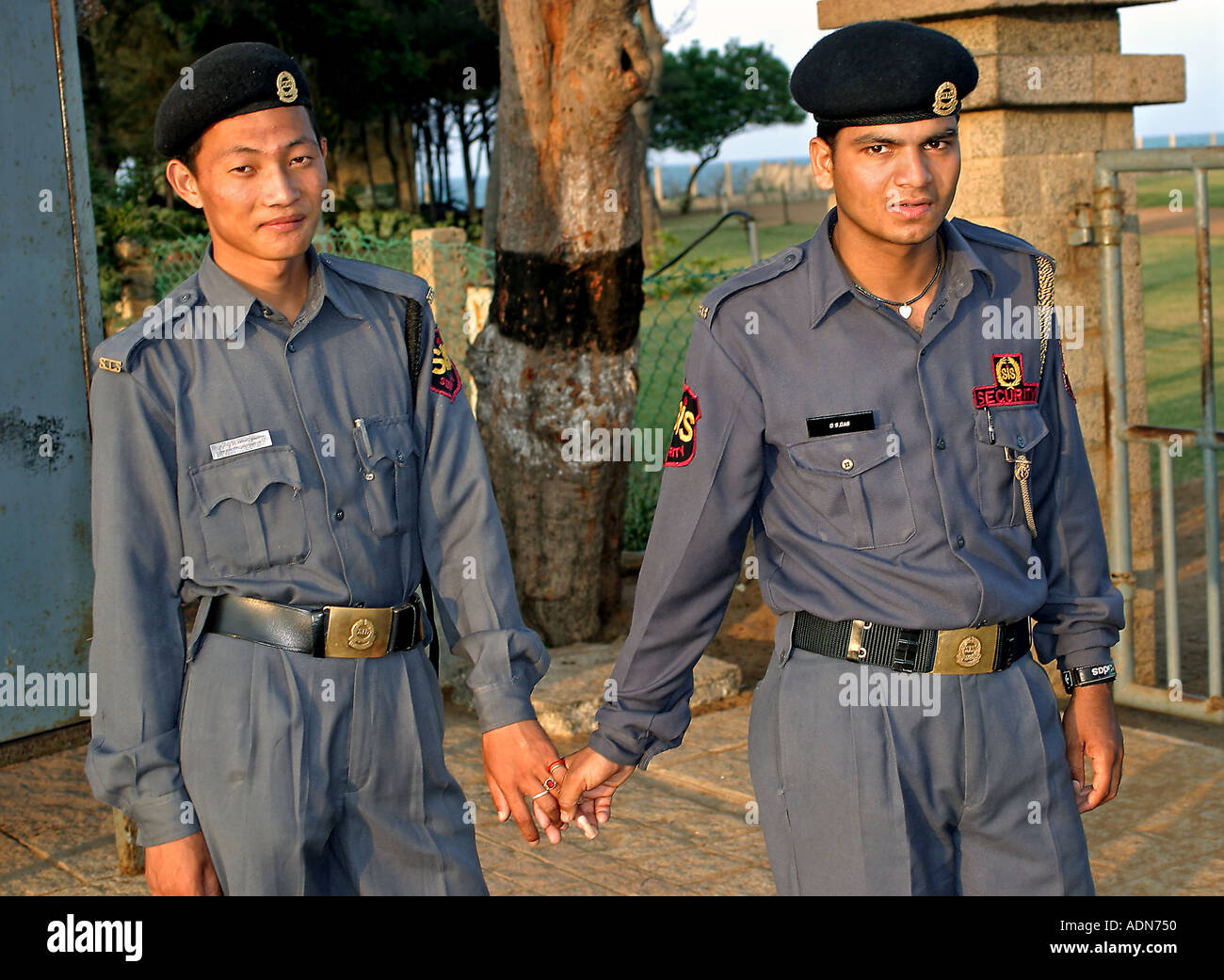 security guards holding hands india Stock Photo - Alamy