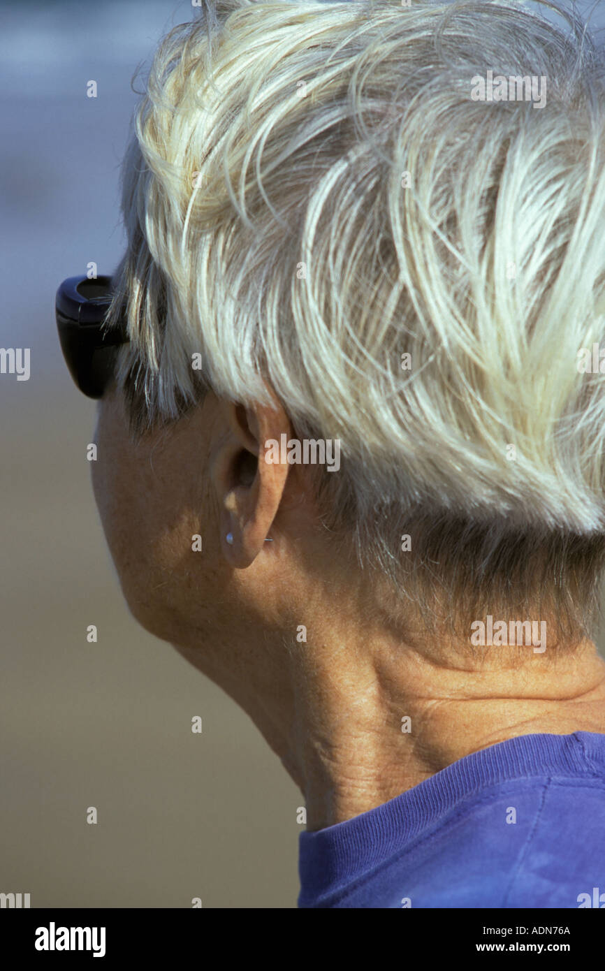 Woman wearing ear rings hi-res stock photography and images - Alamy
