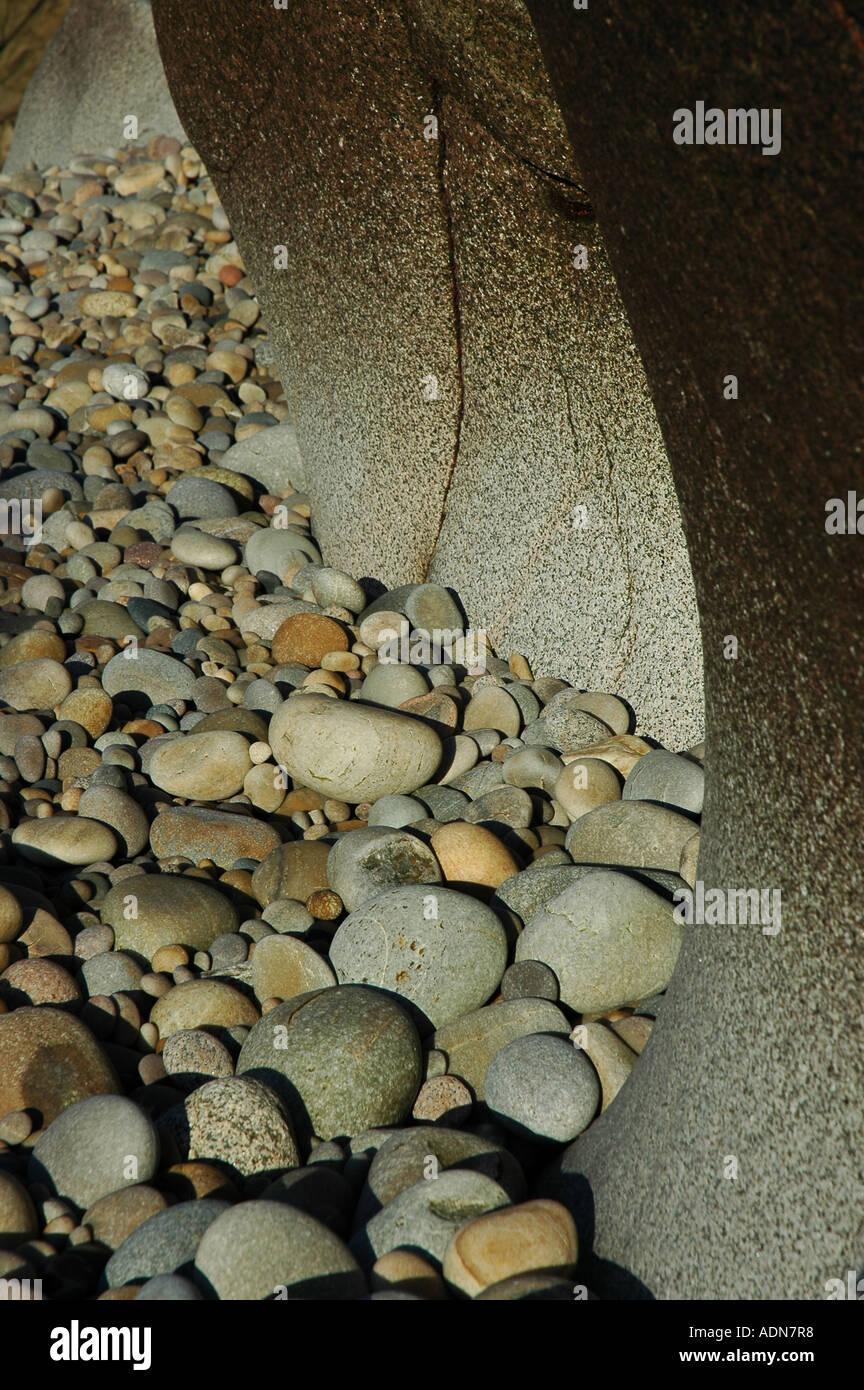 Pebbles and eroded granite in Donegal cove, Ireland Stock Photo - Alamy