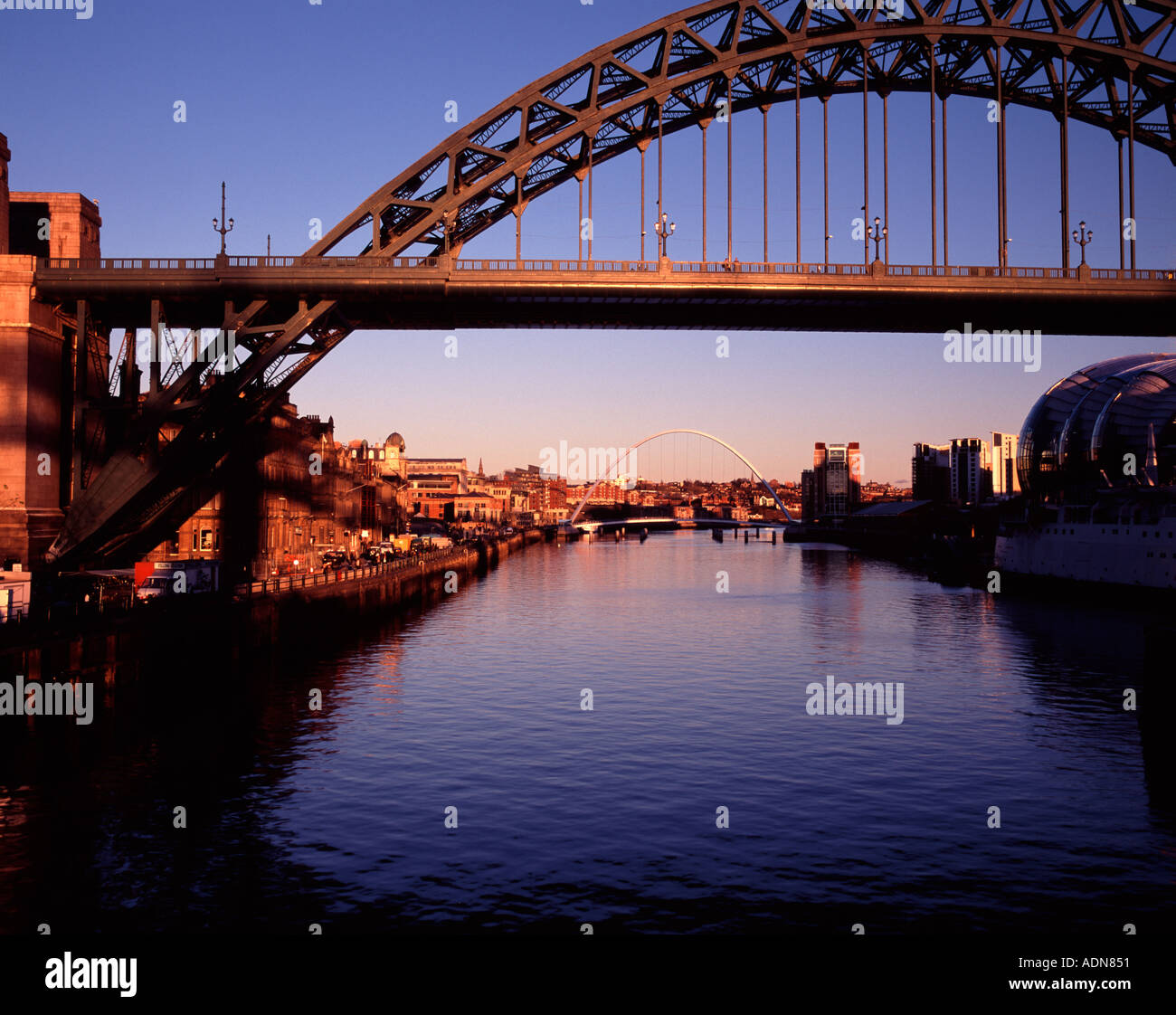 Tyne and millennium bridges at sunset hi-res stock photography and ...