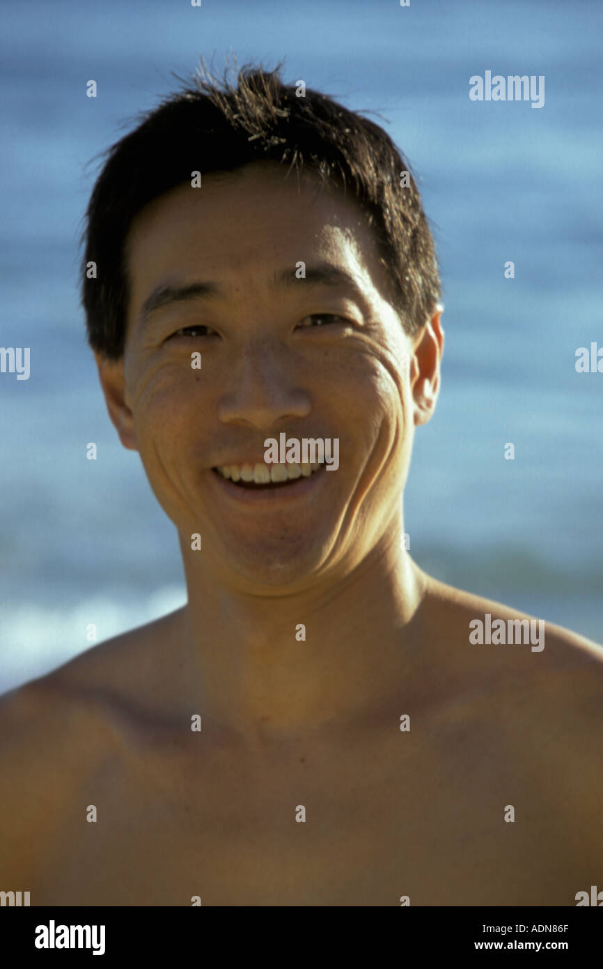 Australia Queensland smiling man at beach Stock Photo - Alamy