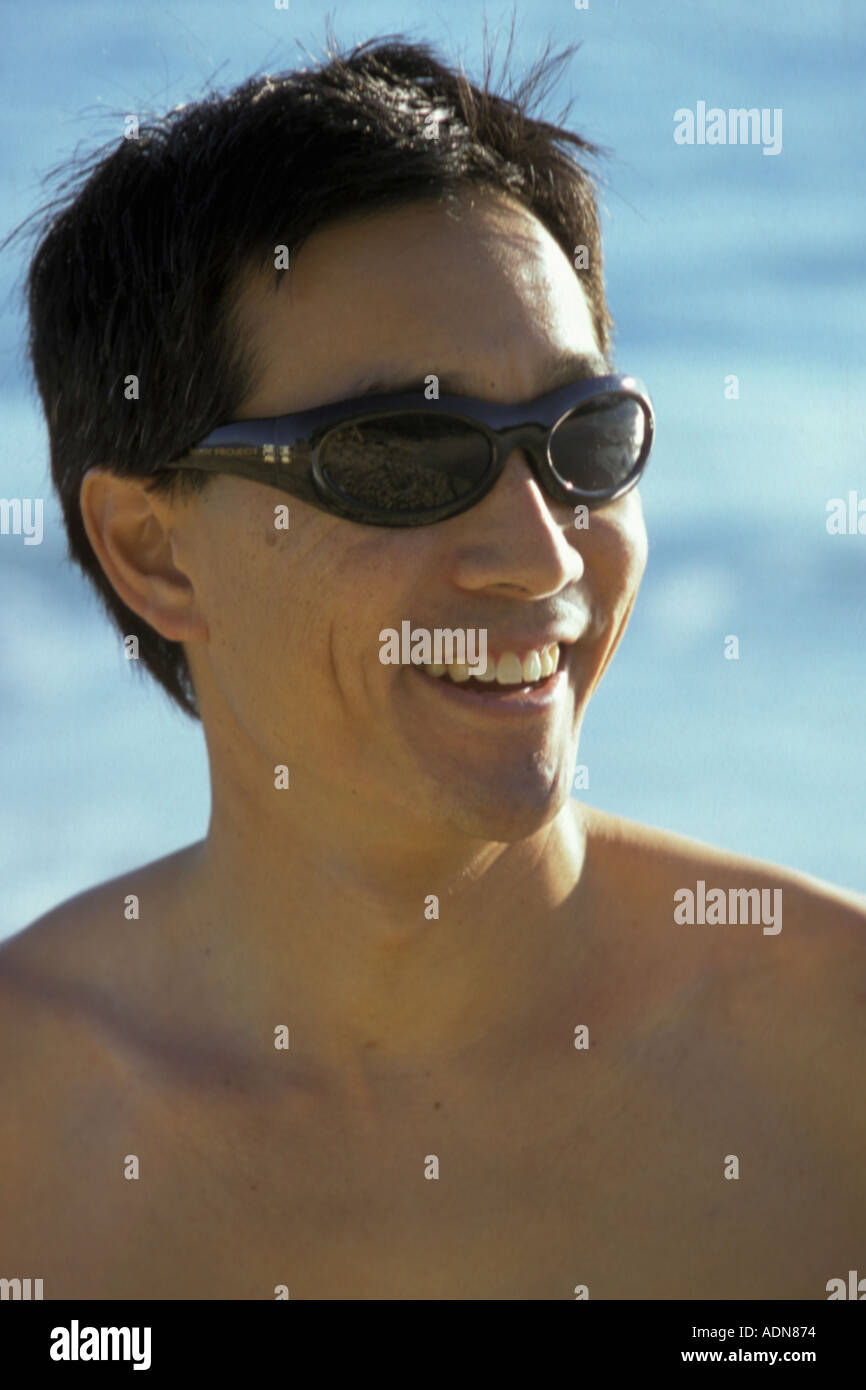 Australia Queensland smiling man at beach Stock Photo - Alamy