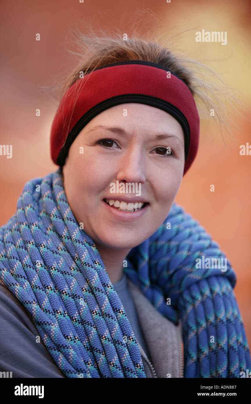 Girl rock climber portrait with rope around neck Stock Photo - Alamy