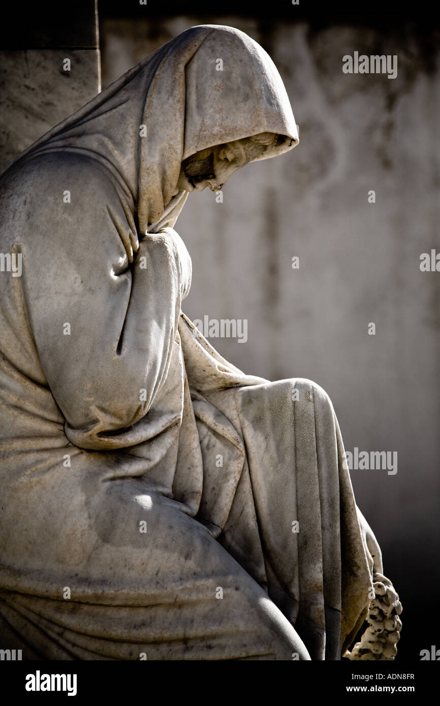 Statue of a robed woman in the Bonifacio cemetery, Corsica Stock Photo ...