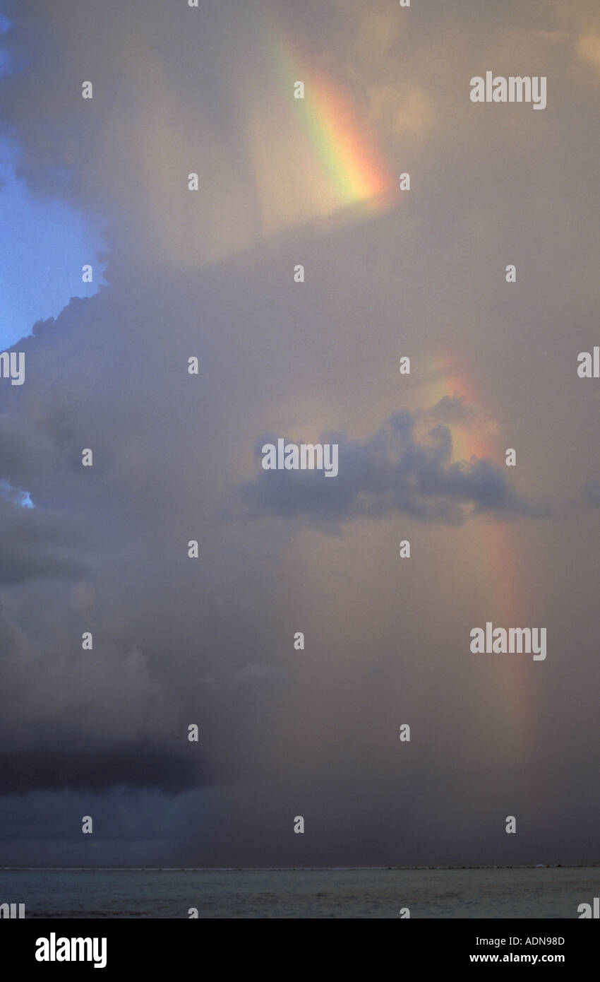 Indian Ocean Maldives rainbow in thundercloud at sunset Stock Photo - Alamy