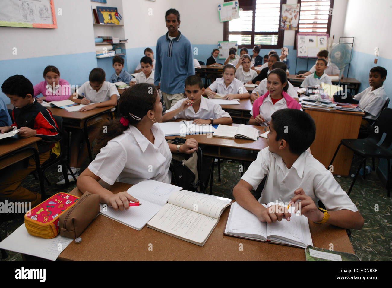 Black male teacher in classroom at Carlos J Finlay secondary school ...