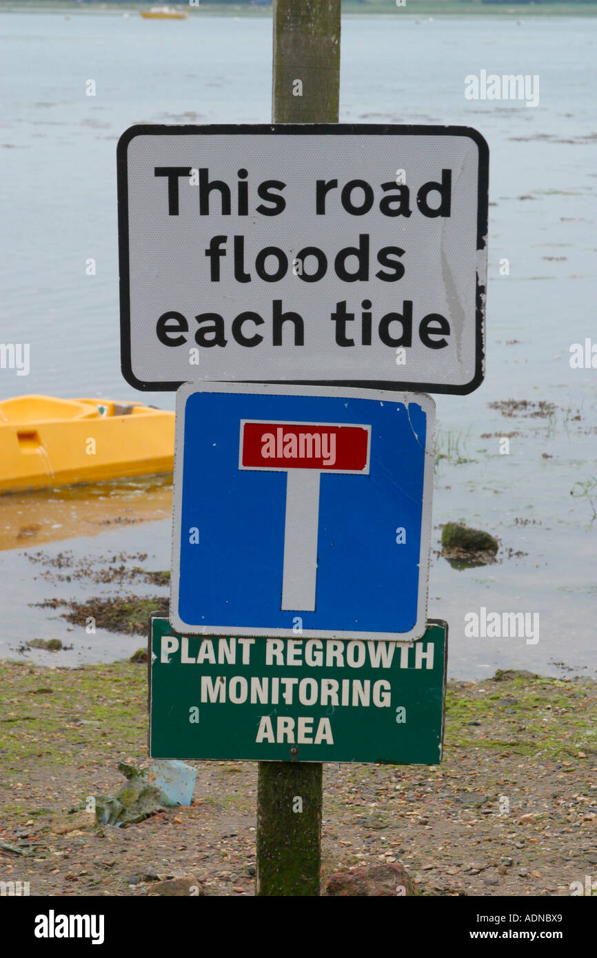 Warning sign about tide flooding at Bosham Harbour, West Sussex Stock ...