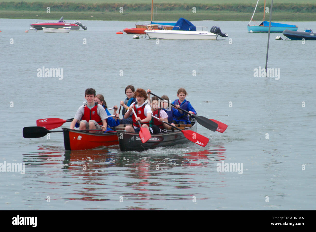 Kids rowing catamaran at Bosham Harbour, West Sussex Stock Photo - Alamy