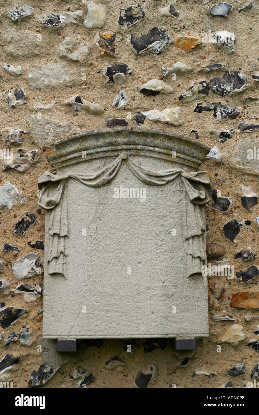 Carved stone tablet set into ruin wall at Boxgrove Priory, West Sussex ...