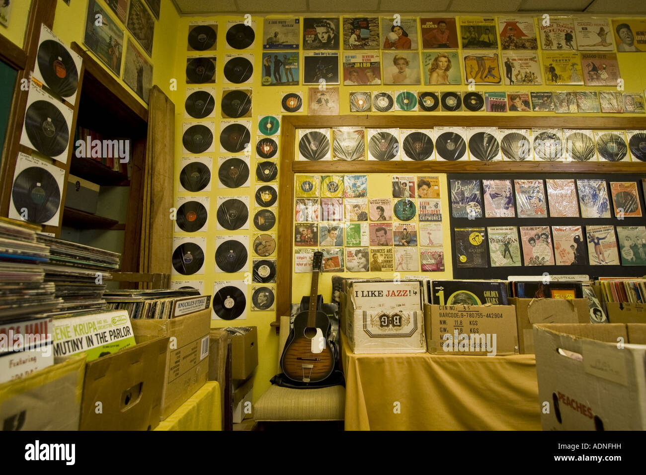 wall in a shop selling vintage records Stock Photo - Alamy