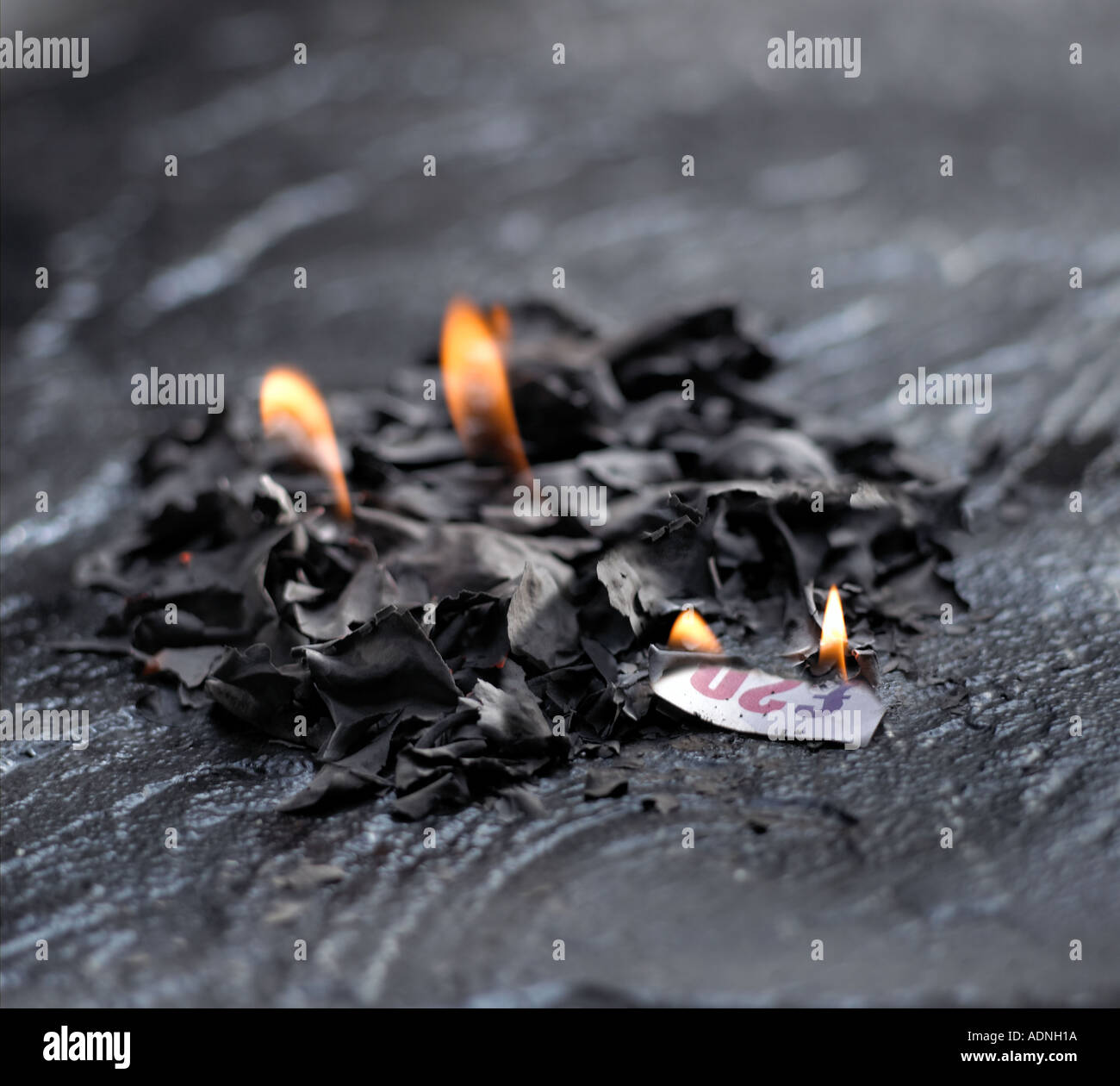 Burned currency hi-res stock photography and images - Alamy