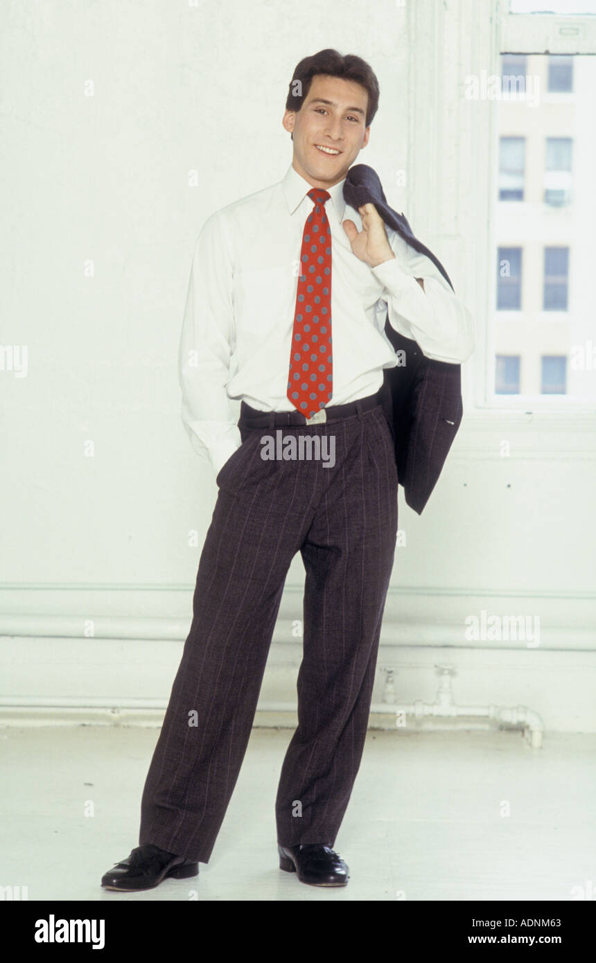 Young Caucasian Man Smiling Holding Suit Jacket Over Shoulder Stock ...