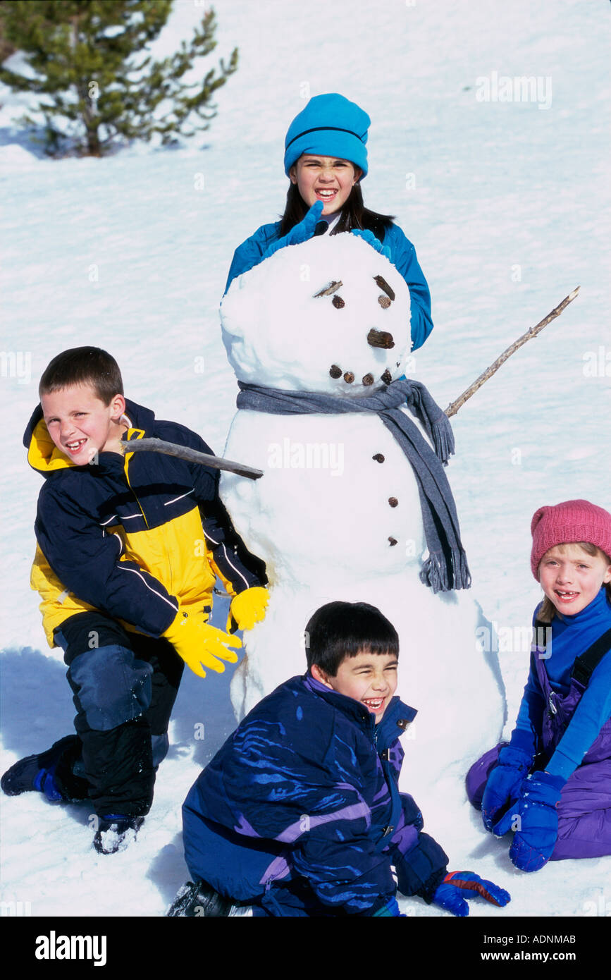 Girls making a snowman hi-res stock photography and images - Alamy