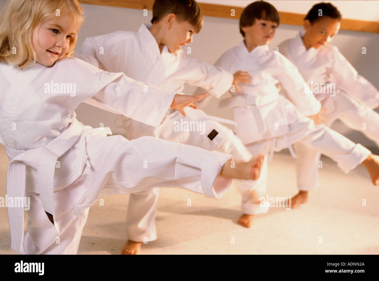 Group of children learning karate Stock Photo - Alamy