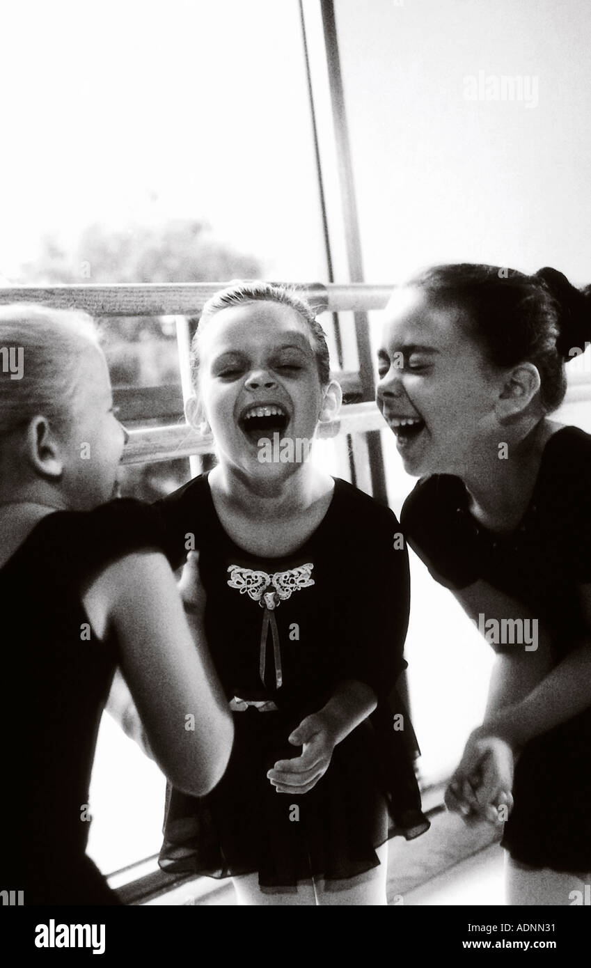 Three ballerinas laughing Stock Photo - Alamy