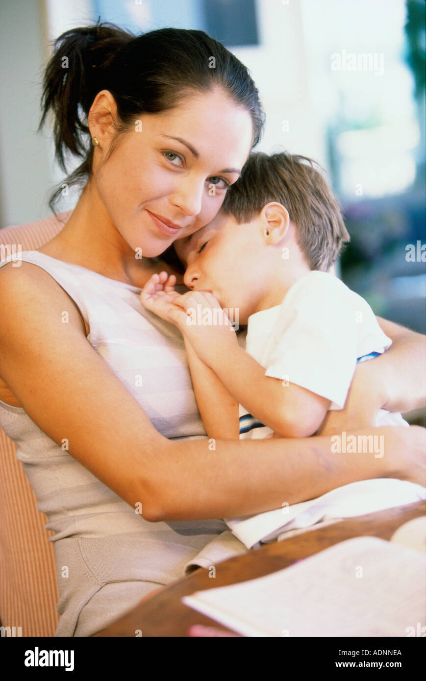 Portrait of a mother hugging her son Stock Photo - Alamy