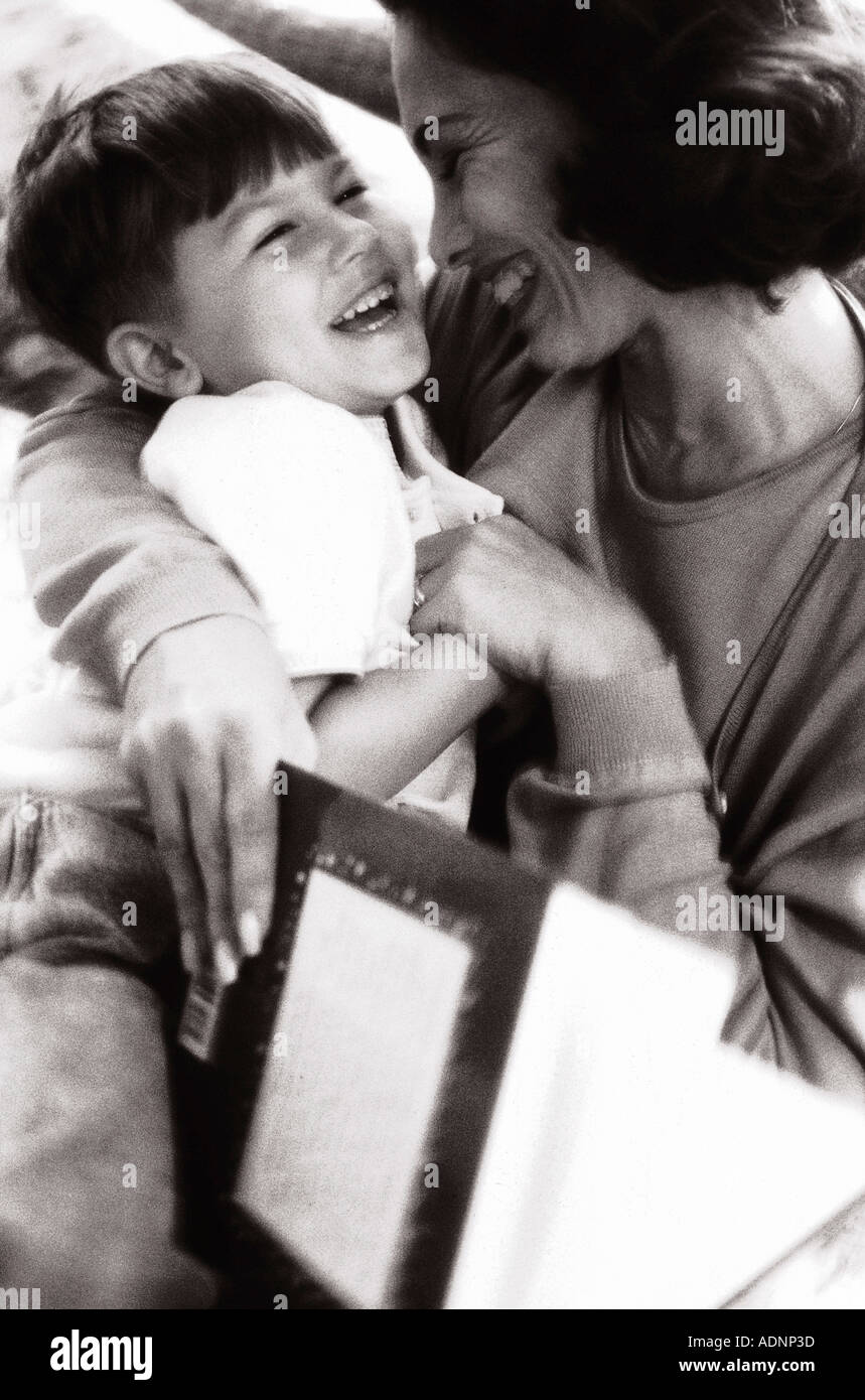 Mother hugging her son Stock Photo - Alamy