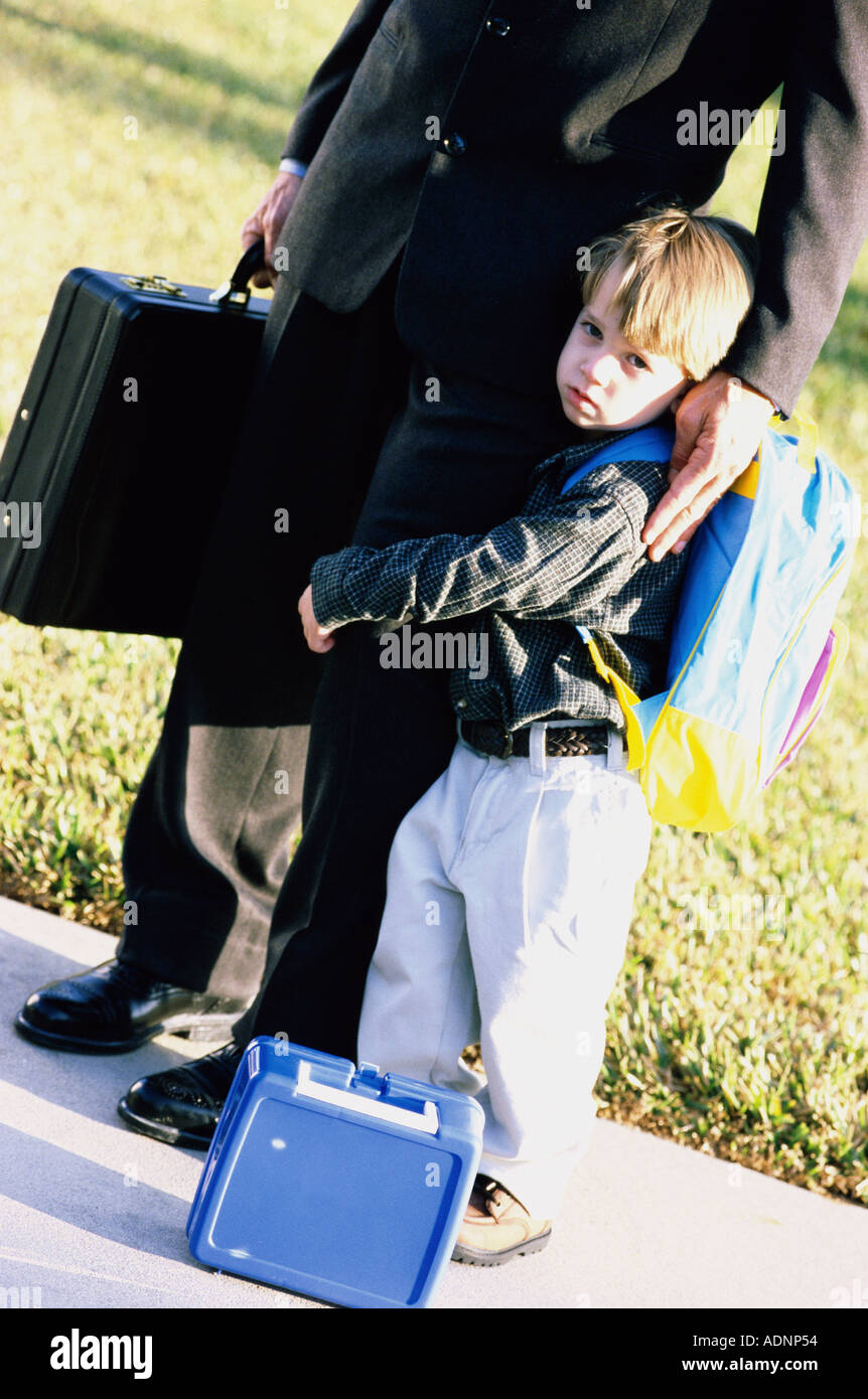 Son standing with his father Stock Photo - Alamy