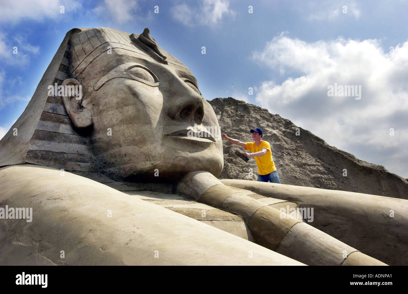Man building sandcastle on the beach hi-res stock photography and ...