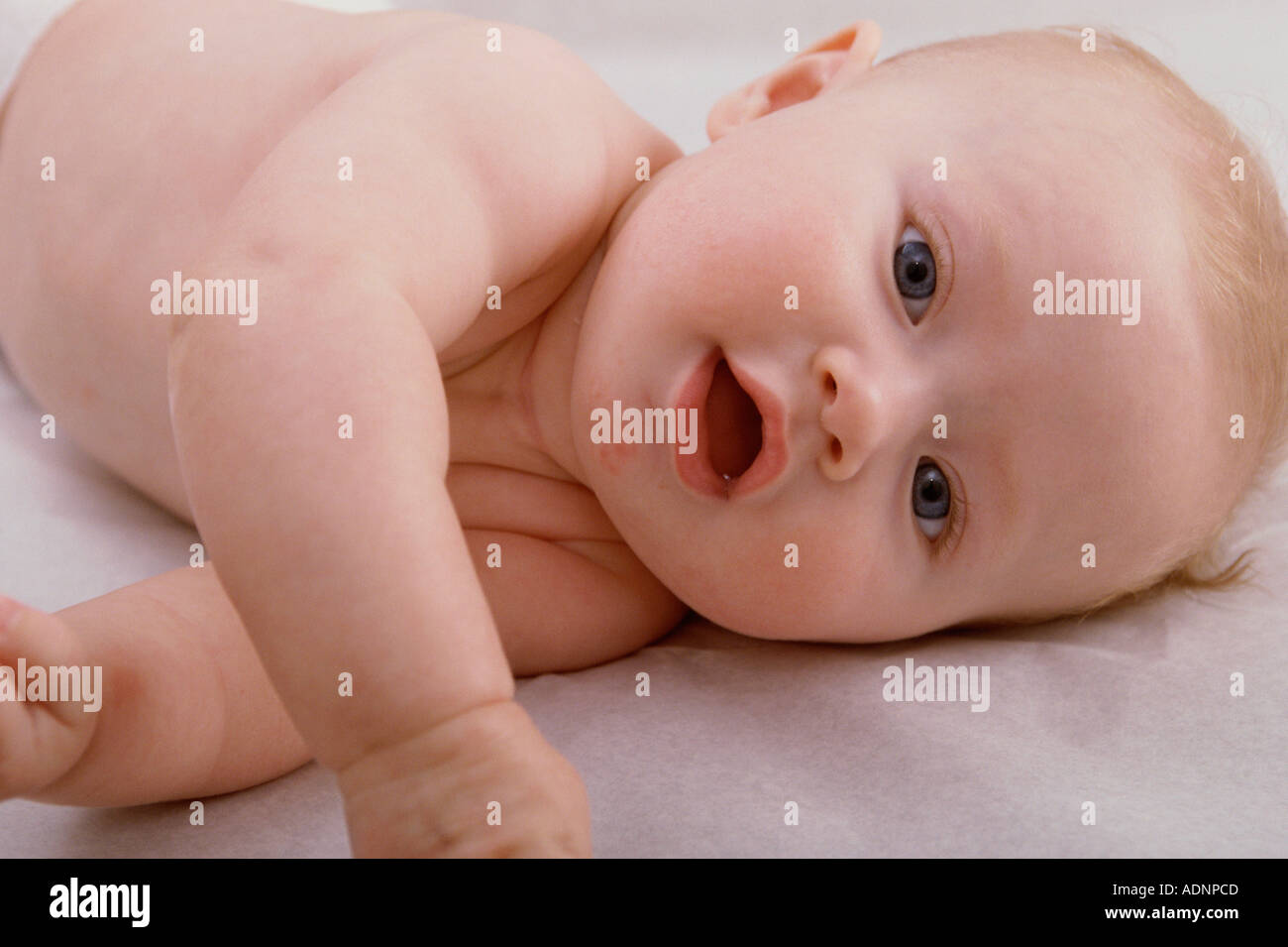 Close-up of a baby boy lying on his side Stock Photo - Alamy