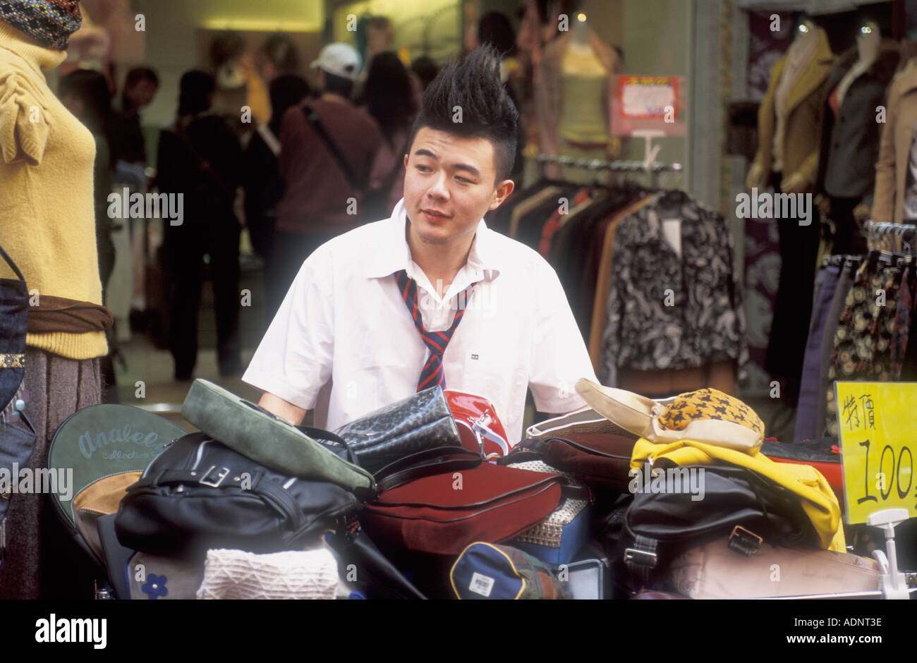 Chinese Young Man Selling Hand Bags In Asian Traditional Outdoor Market ...