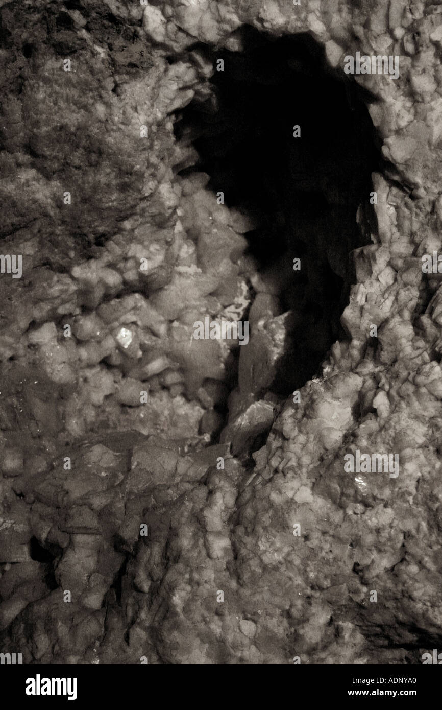 Black and White cave opening in crystalized rock formation Wookey Hole ...