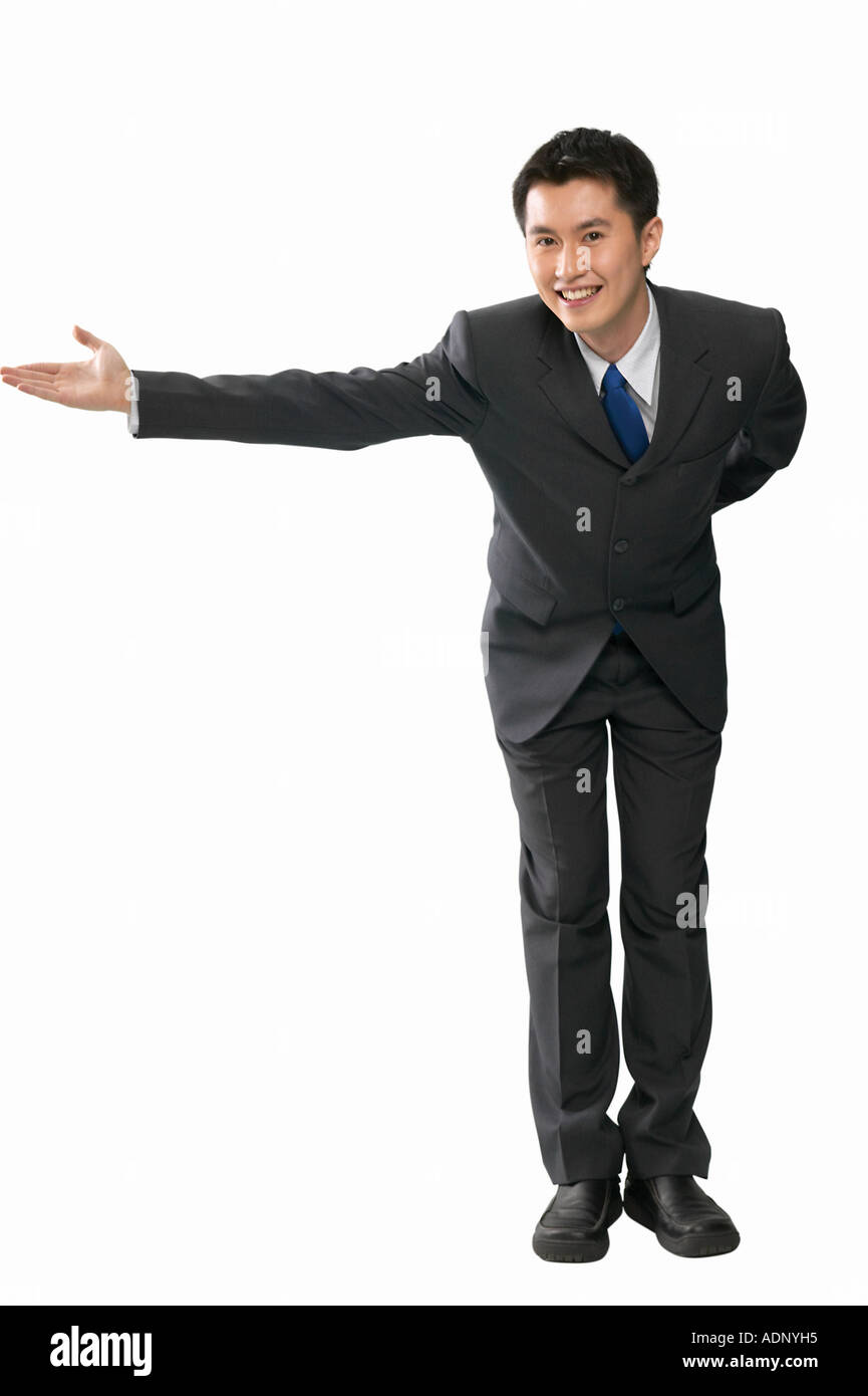 Businessman bowing front view Cut Out Stock Images & Pictures - Alamy