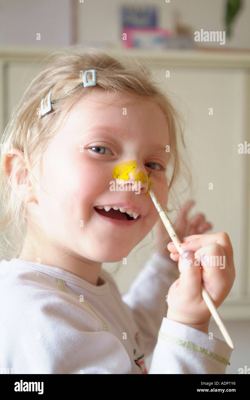 Child with yellow nose Stock Photo - Alamy
