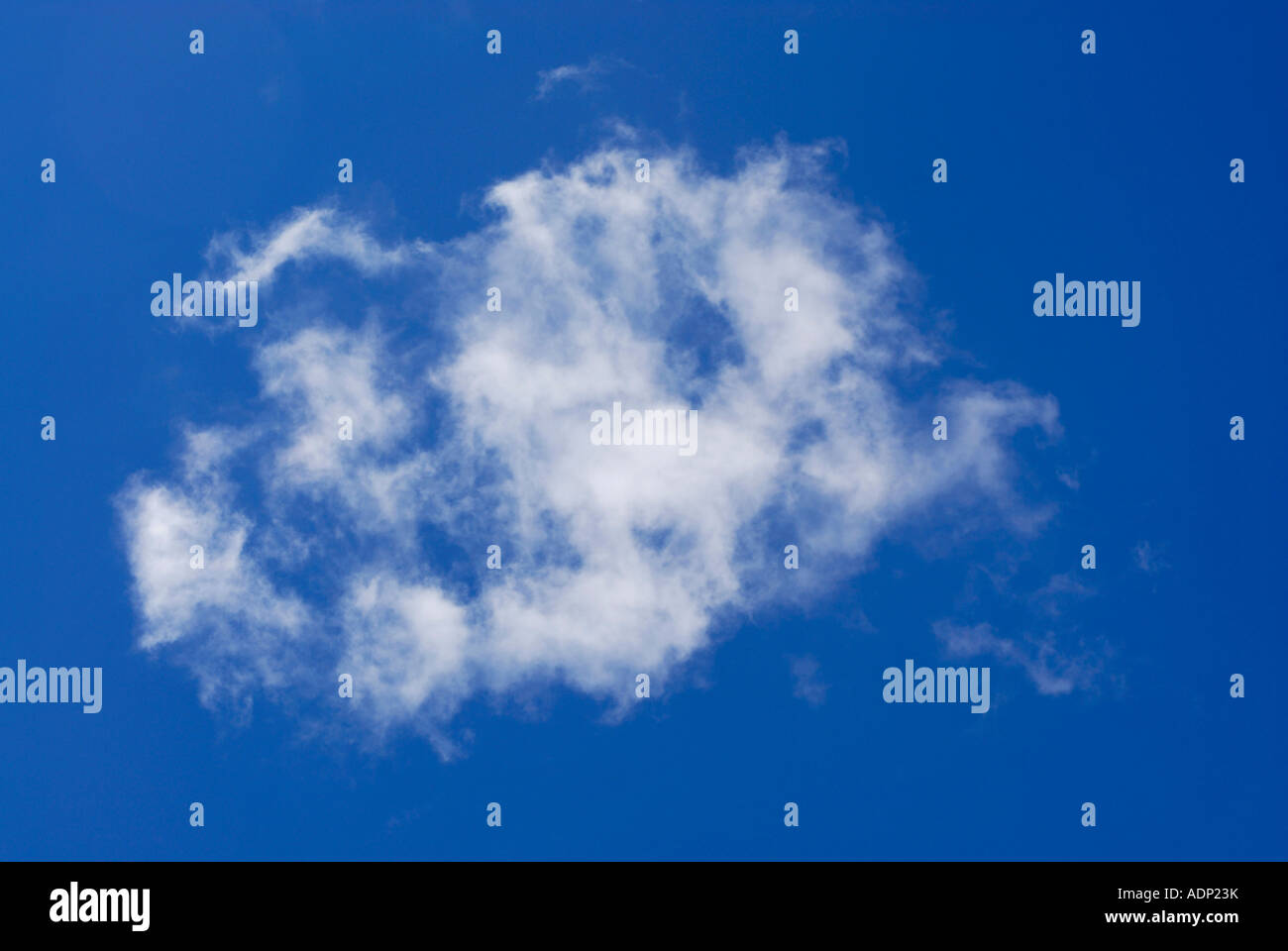Isolated white fluffy clouds against a deep blue sky Stock Photo - Alamy