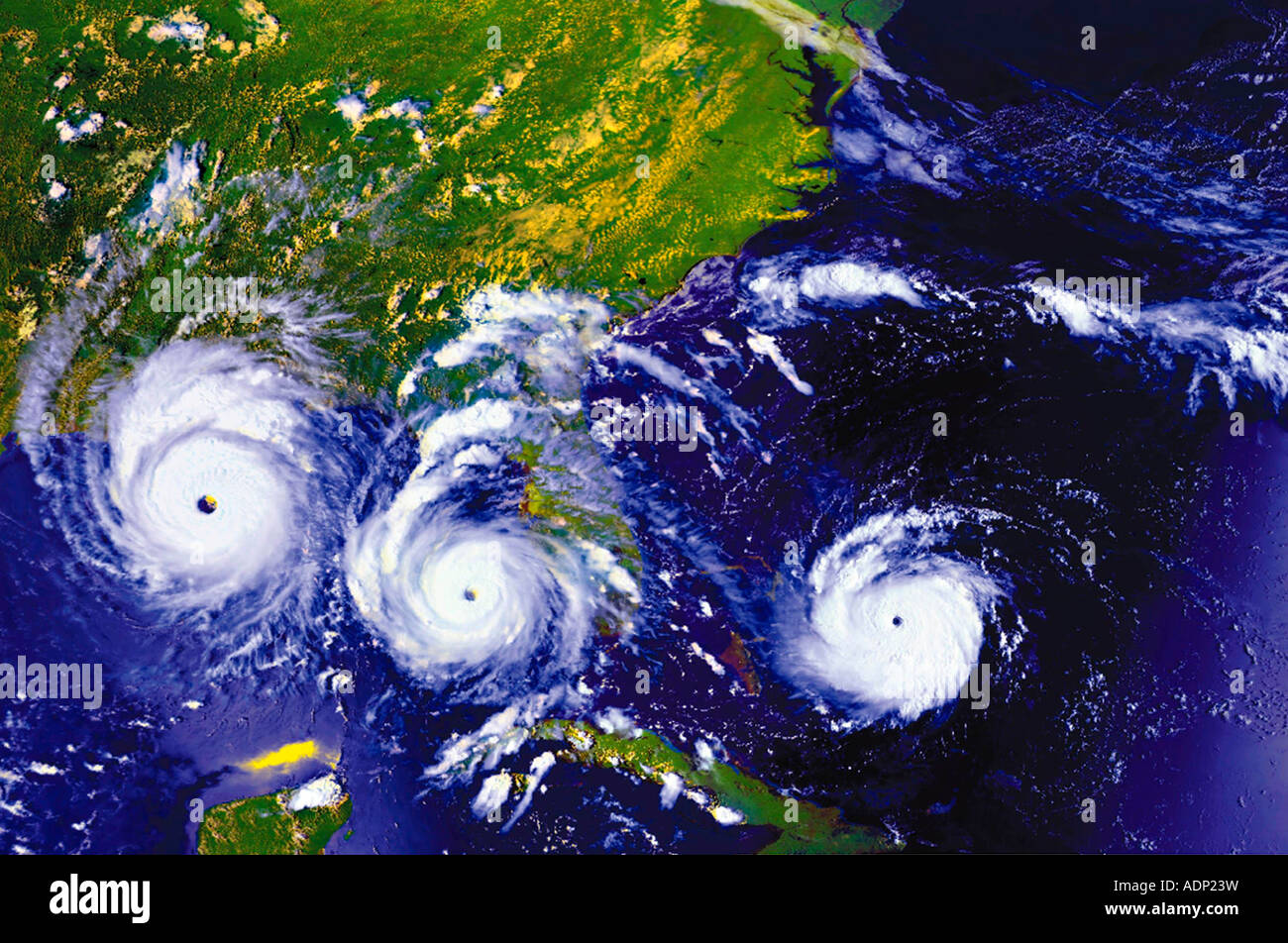 satellite photograph of three hurricanes shown on television screen ...