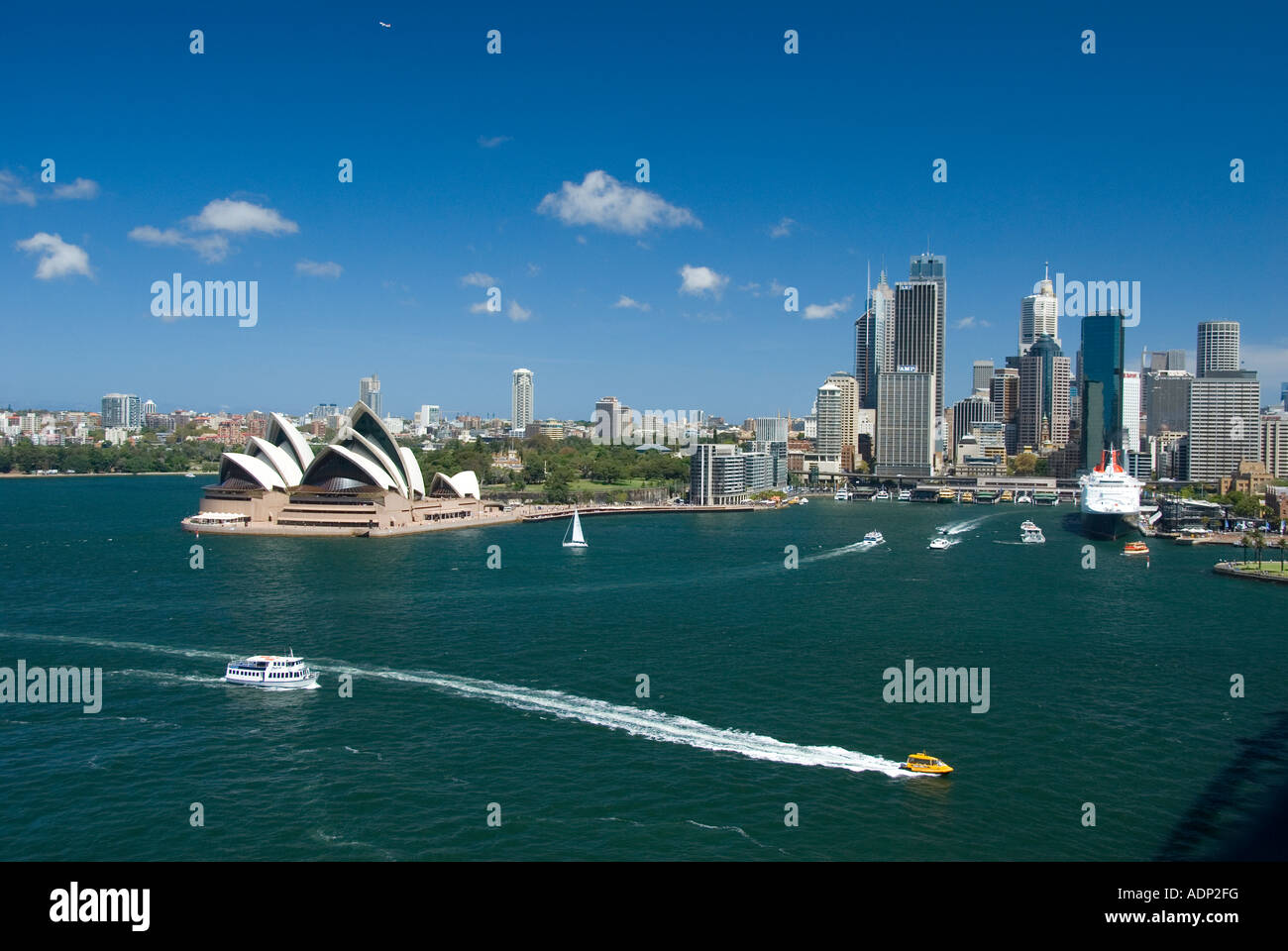 Sydney Opera House and the Queen Elizabeth 2 at her berth in Sydney New ...