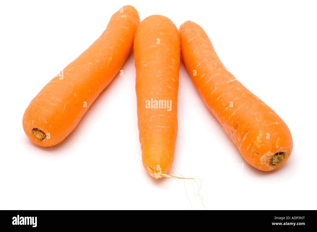 series object on white food Three carrots Stock Photo - Alamy