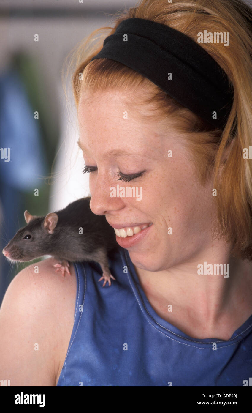 Girl with a pet rat walking on her shoulder Stock Photo - Alamy