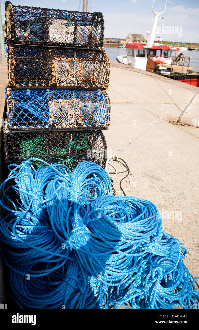 crab or lobster pots with rope at side of harbour Stock Photo - Alamy
