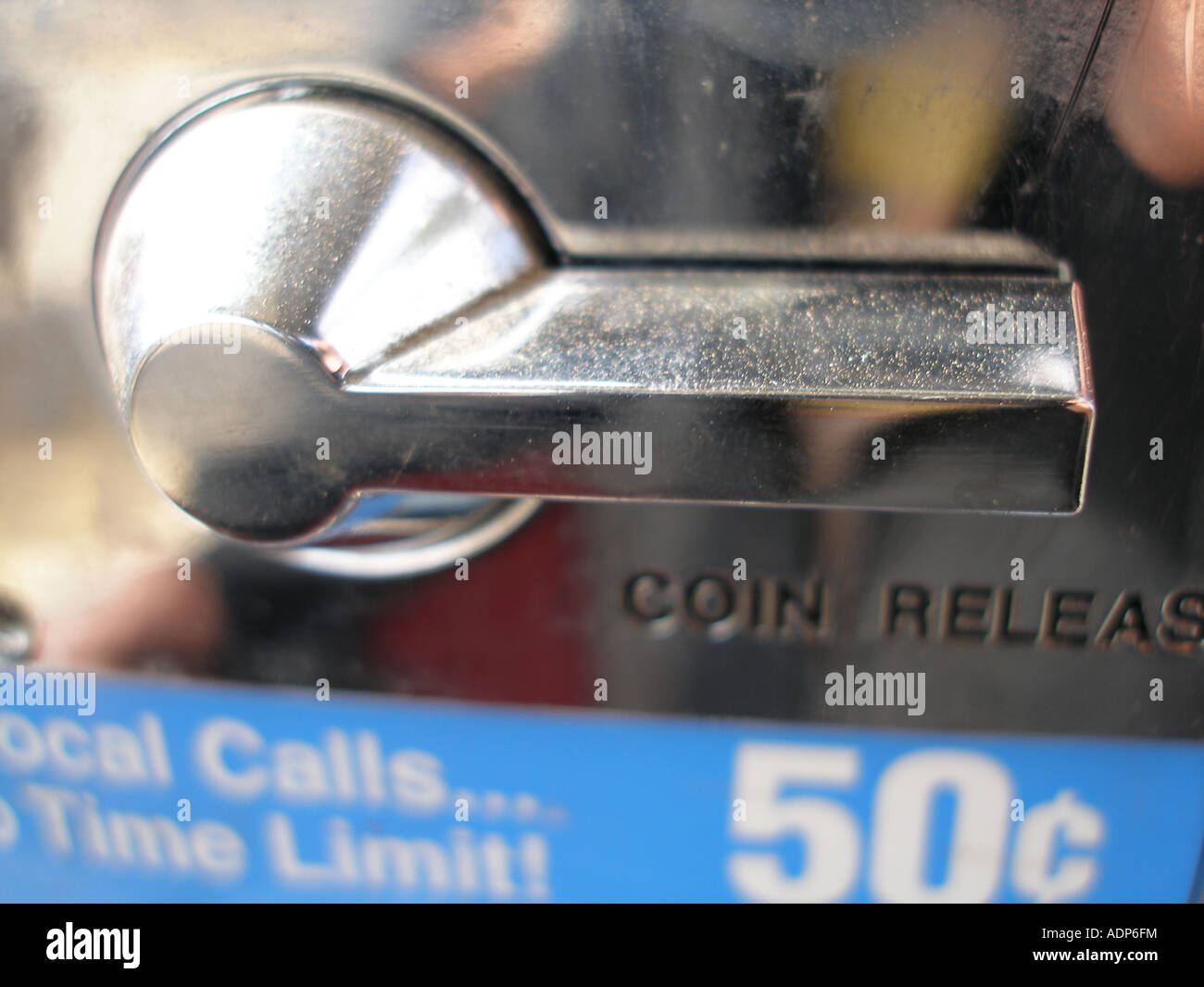 Coin release on a pay phone Stock Photo - Alamy