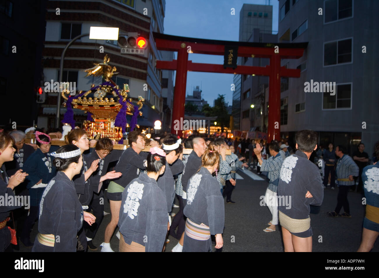 Mikoshi portable shrine parade in front of Torii gate Annual Festival ...